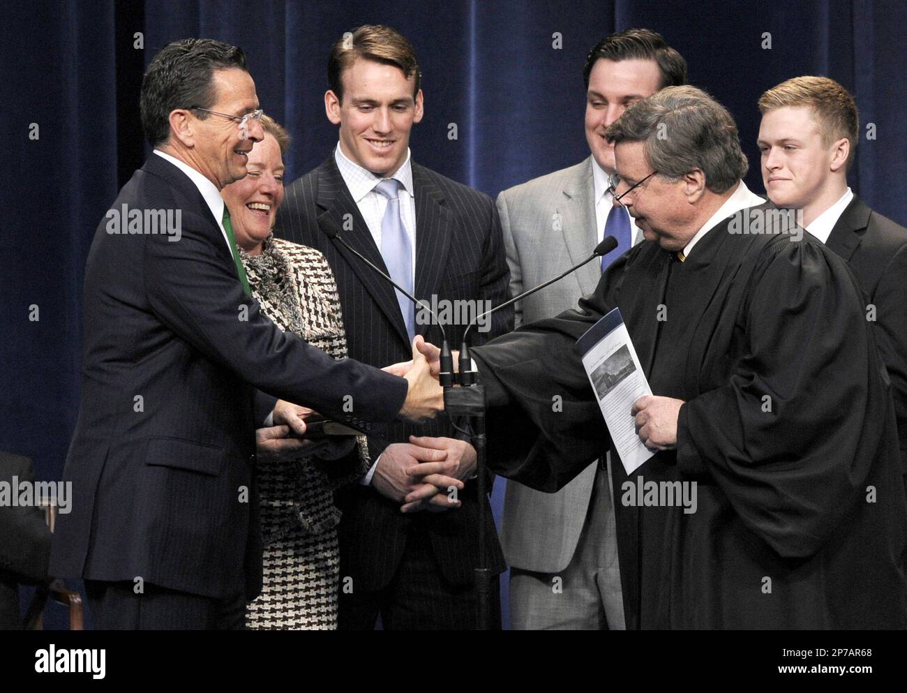 With his wife Cathy and sons at his side, Dan Malloy, left, is ...
