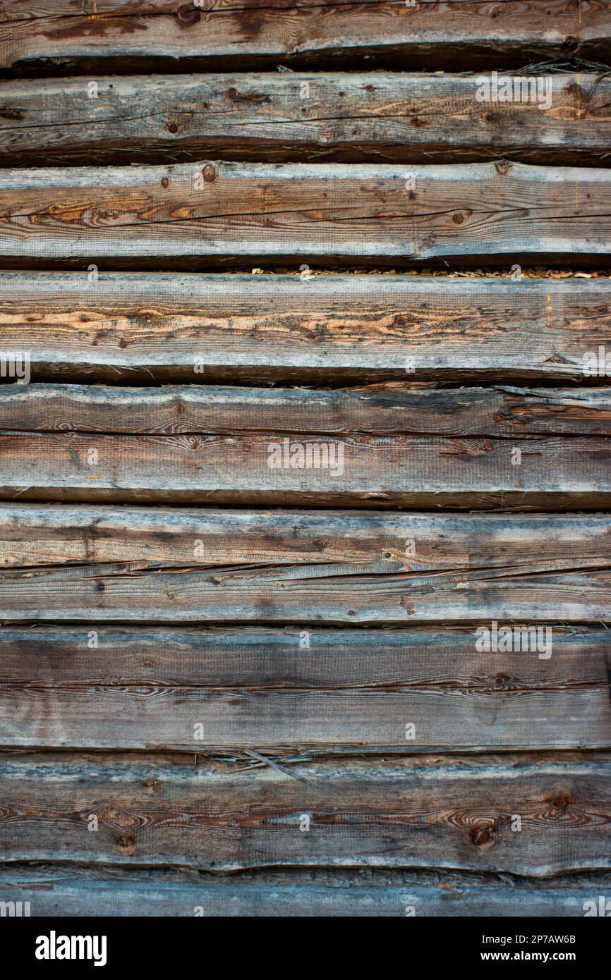 Old rustic aged wooden barn wall. Vertical planks, close up, front view ...