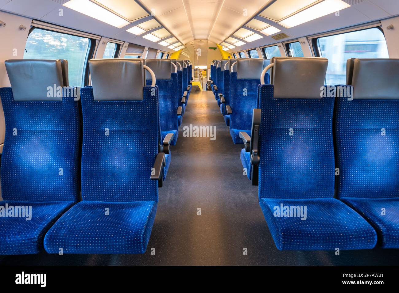 Empty blue seats inside train cabin, corridor view, no people Stock ...