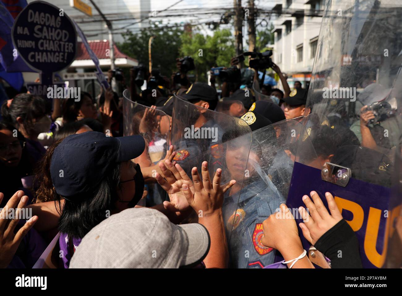 Manila, Philippines. 8th Mar, 2023. Protesters scuffle with policemen ...