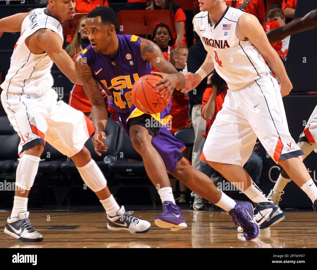 LSU guard Aaron Dotson (45) dribbles between Virginia guard Mustapha ...