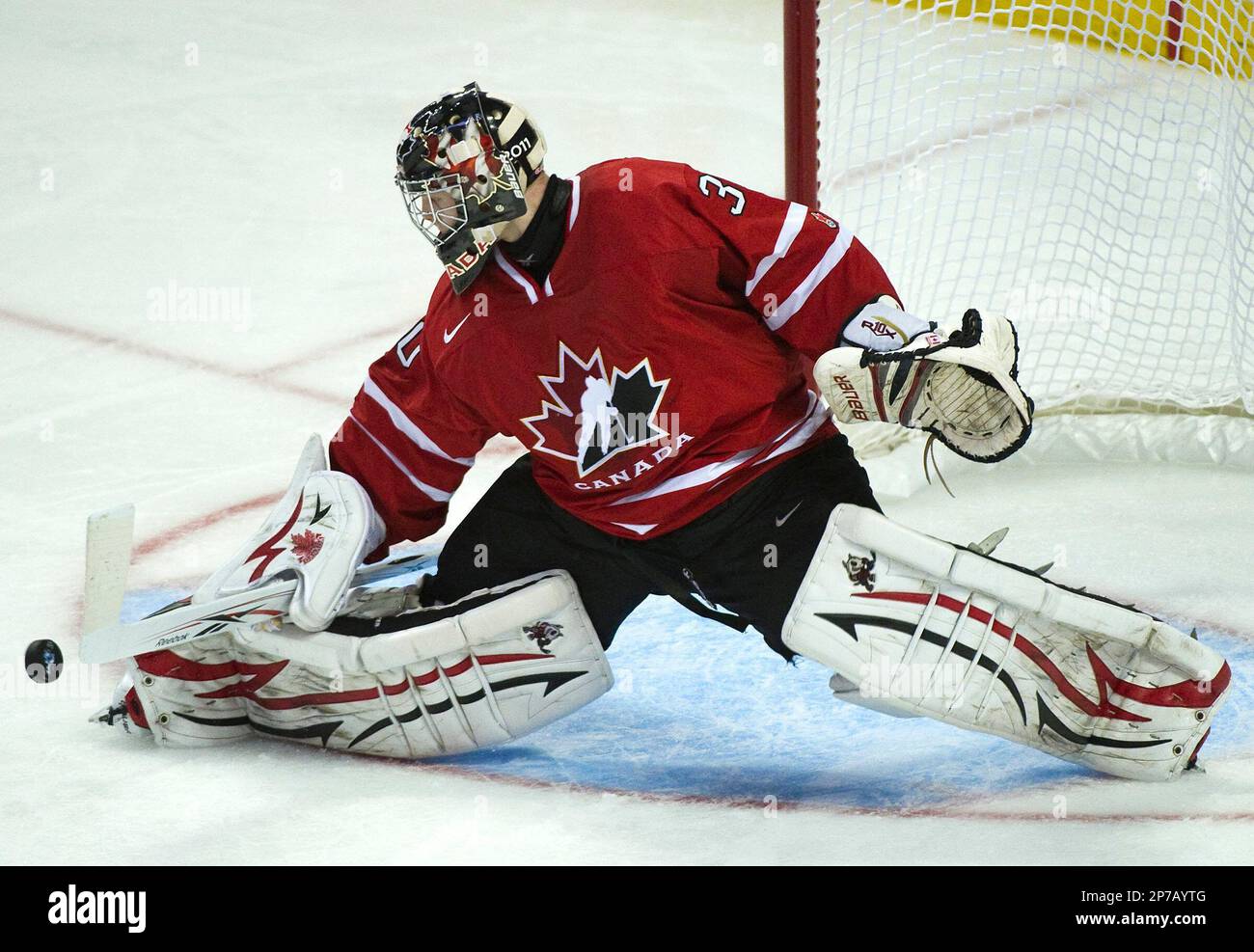 Canada goalie Mark Visentin makes a pad save against Switzerland during ...