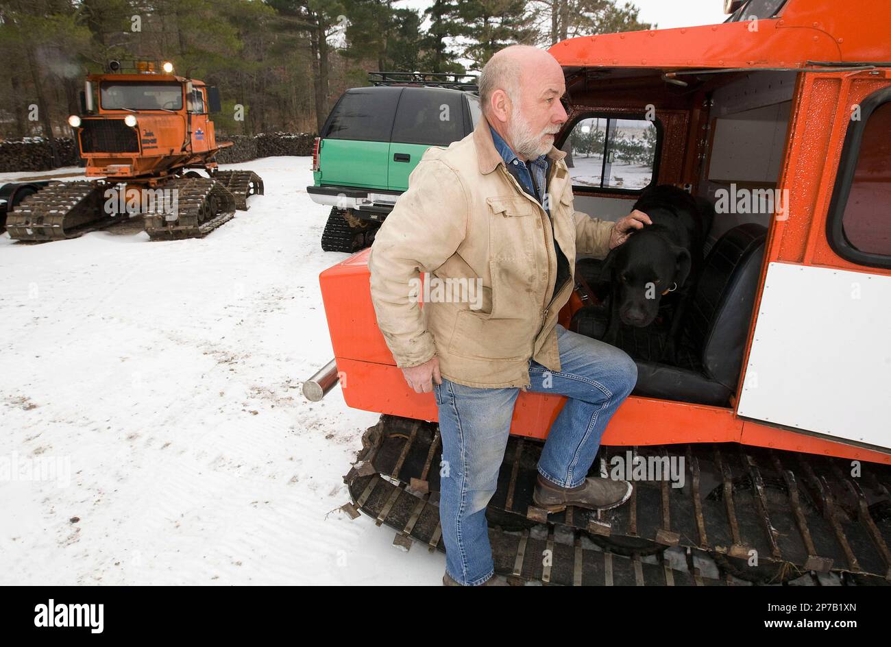 In this photo taken Dec. 20, 2010, Fred Wilhite and Labrador retriever ...