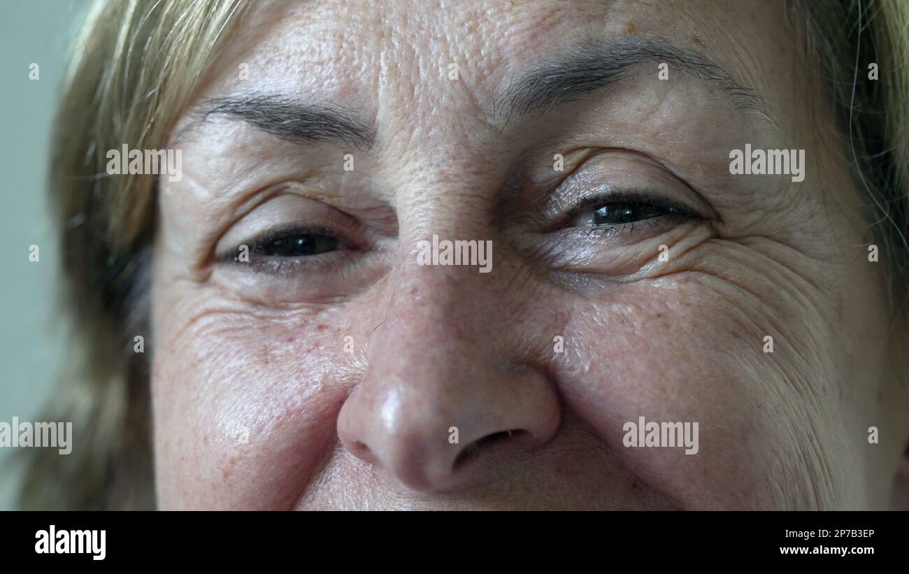 One happy senior woman macro eyes close up smiling at camera. Mature ...