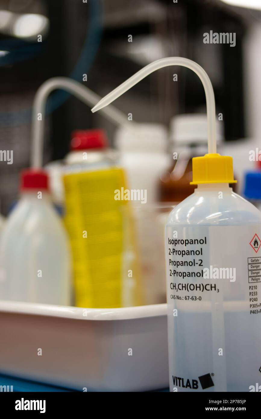 Isopropanol plastic bottle and dispenser. Close up shot in a science ...