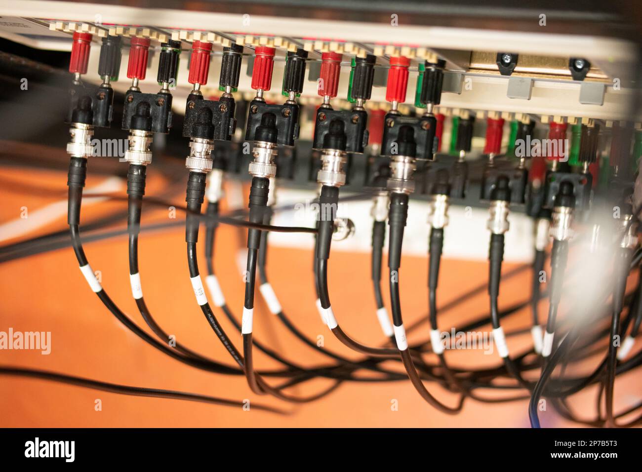 Electronic Signal Processing Devices In A Science Lab Many Connected Cables In Sockets