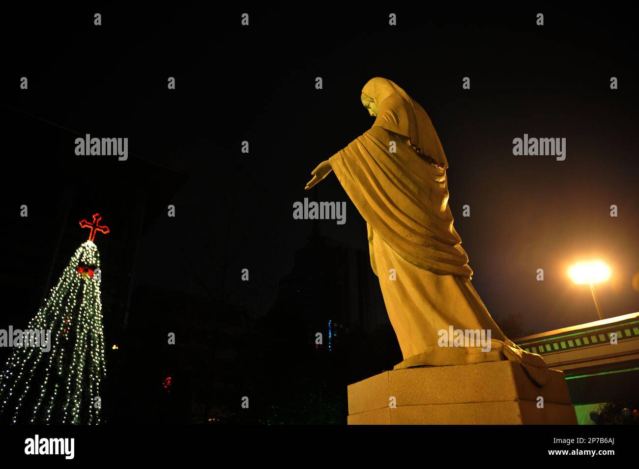 A Christmas tree is displayed outside a Catholic church on Christmas ...