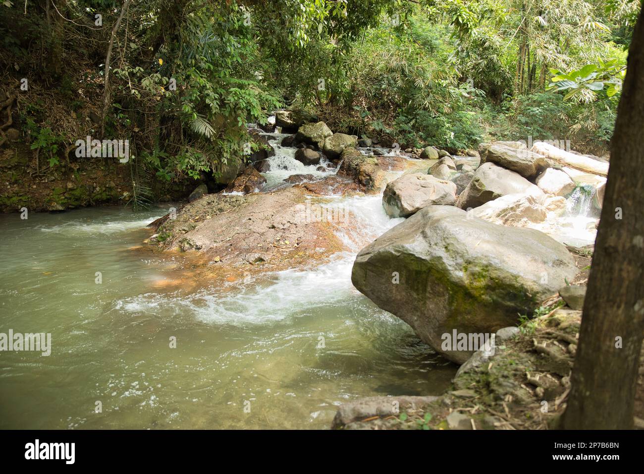 Peaceful shot of the hot spring of Malanage on Flores flowing down ...