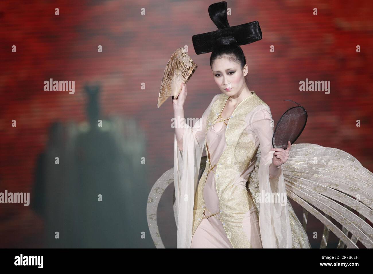 A model displays Hong Kong vision artist Tim Yip's works during the ...