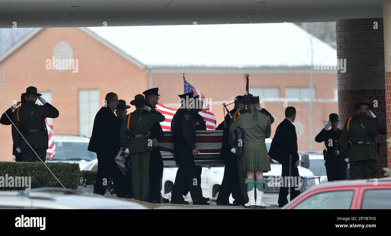 Law enforcement officers carry the casket of Border Patrol officer and ...