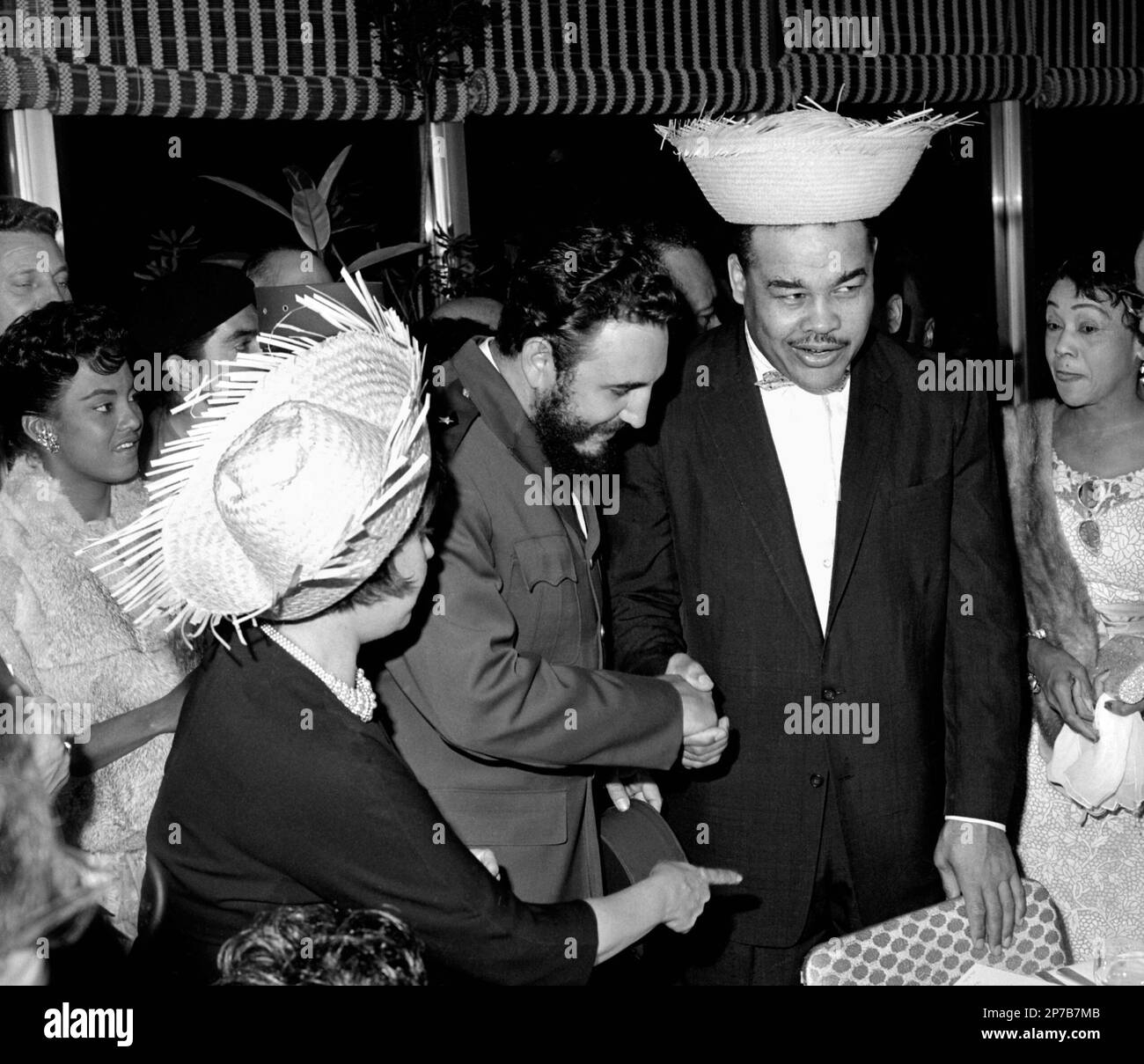 Cuban President Fidel Castro, third right, shakes hands with U.S. boxer ...
