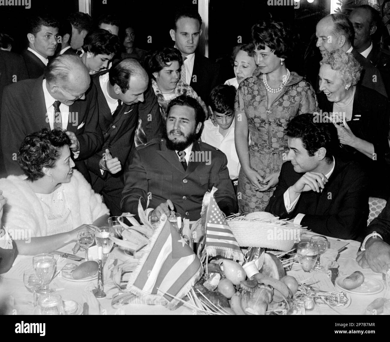 Cuban President Fidel Castro, seated center, speaks to unidentified ...