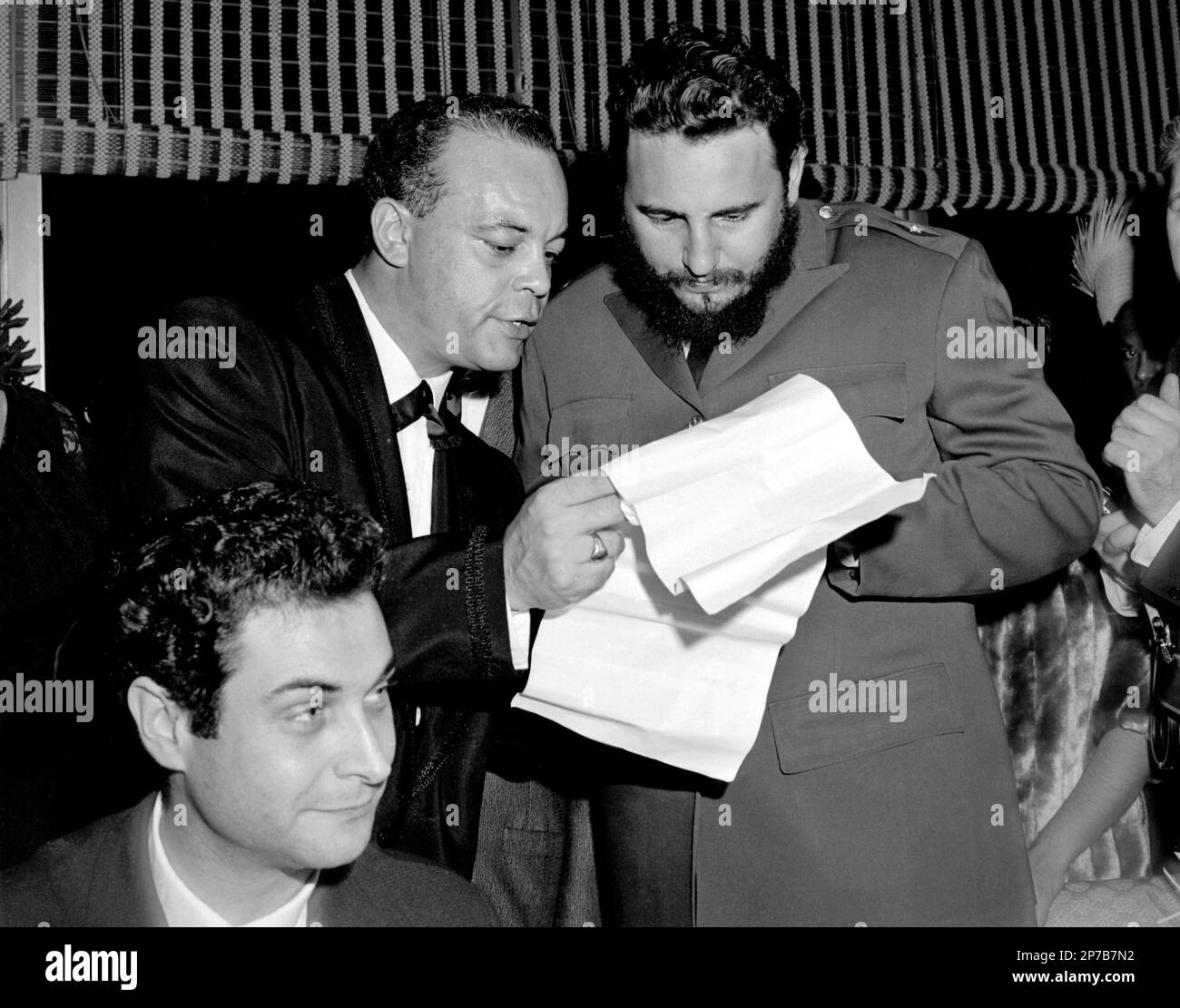Cuban President Fidel Castro, right, speaks to an unidentified man ...