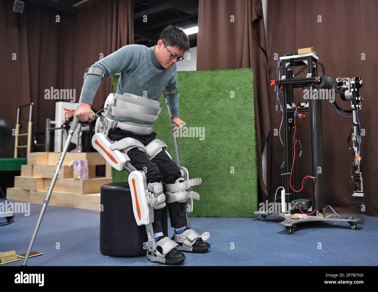 Chengdu, China's Sichuan Province. 6th Mar, 2023. A paraplegic stands ...