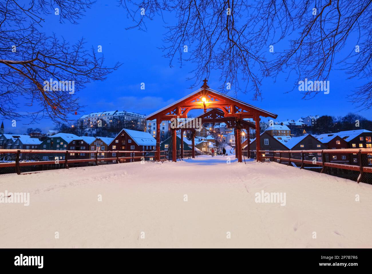 Twilight in Trondheim, spring snowfall, view of the Old Bridge ( den ...