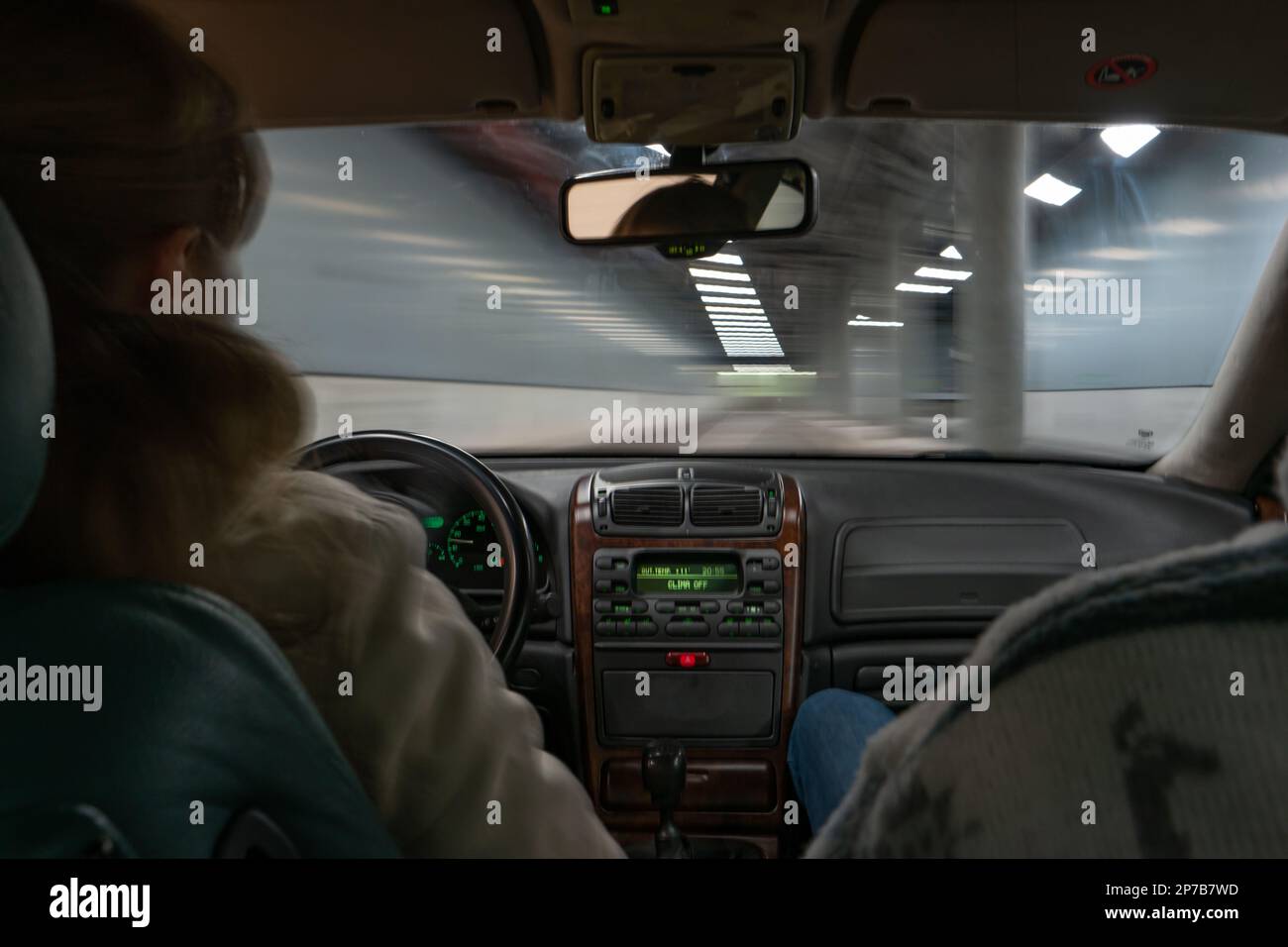 Car driving at night. Inside the car view, Caucasian female driver and ...