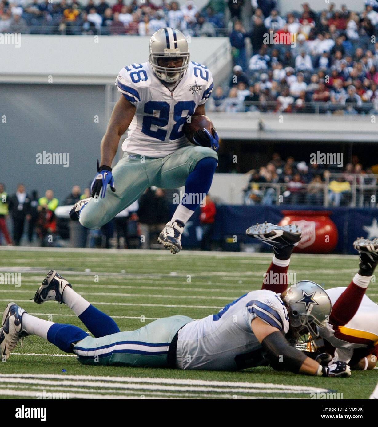 Dallas Cowboys running back Felix Jones (28) jumps for a first down ...