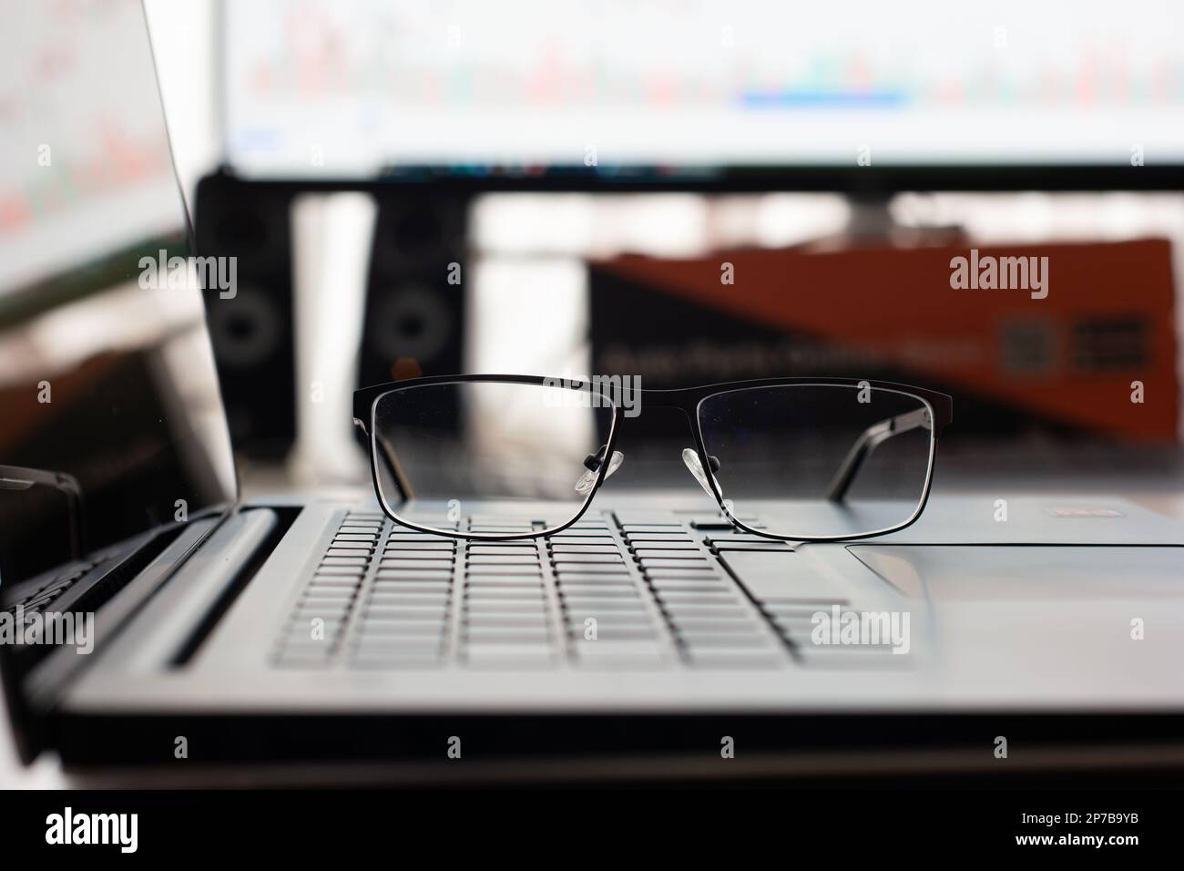 Clear reading glasses, black rim, on a laptop keypad, no people Stock ...