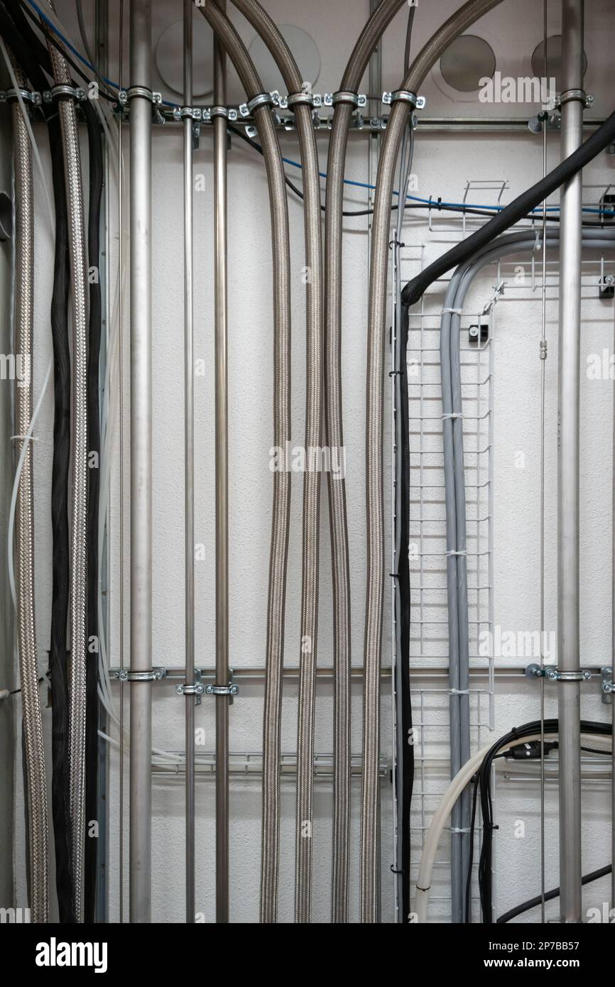 Industrial wall mounted vertical running stainless aluminum pipes Stock ...