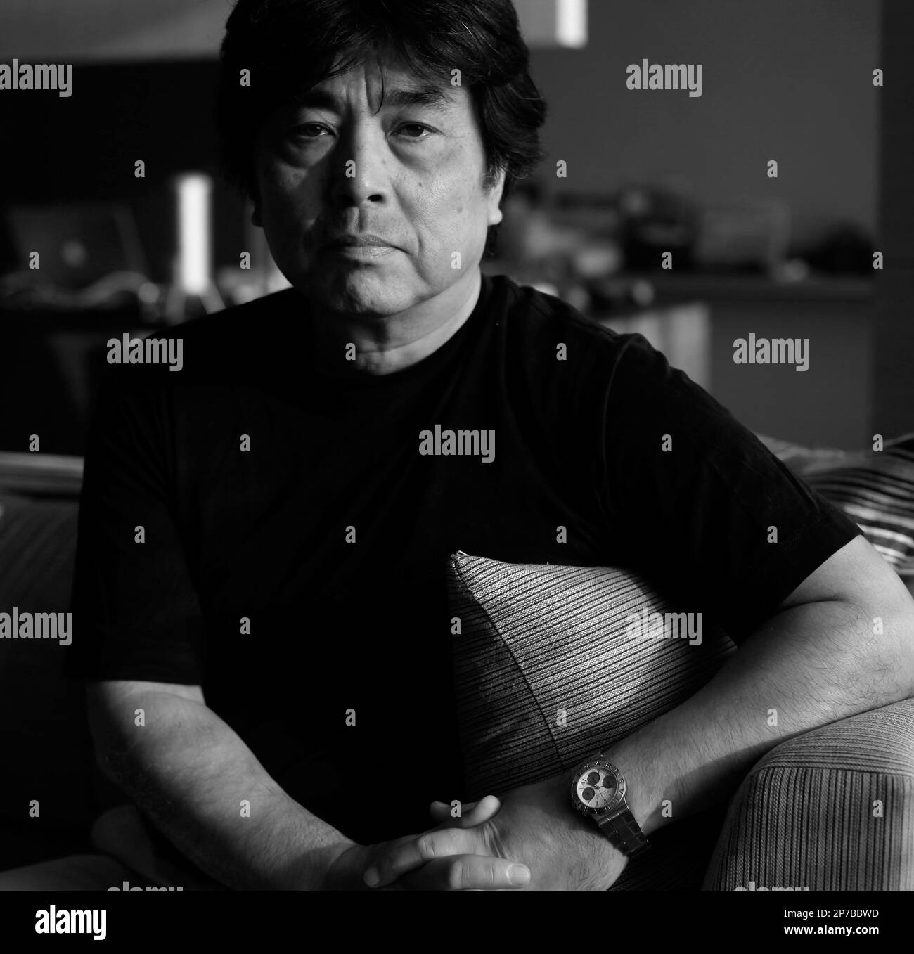 Japanese novelist and filmmaker Ryu Murakami poses for photos in Tokyo ...