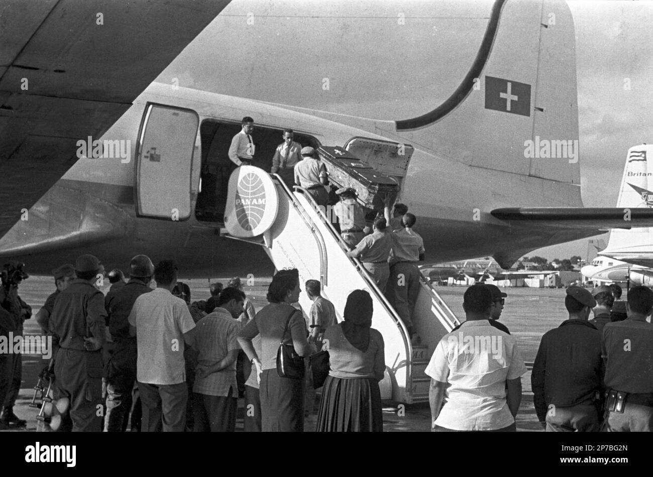The coffin containing the body of U.S. pilot Rudolf Anderson is loaded ...