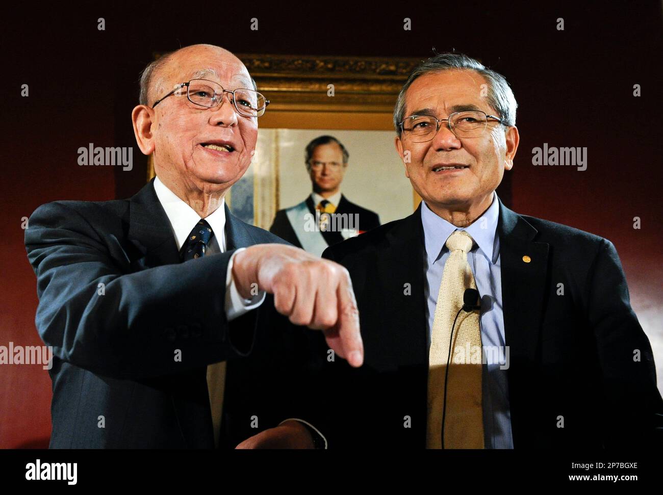 Akira Suzuki, left, of Japan and his compatriot Ei-ichi Negishi meet ...