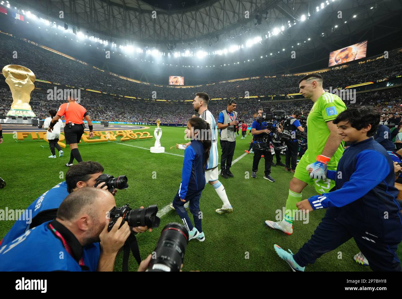 Argentina captain Lionel Messi leads his teammates out to the pitch ...