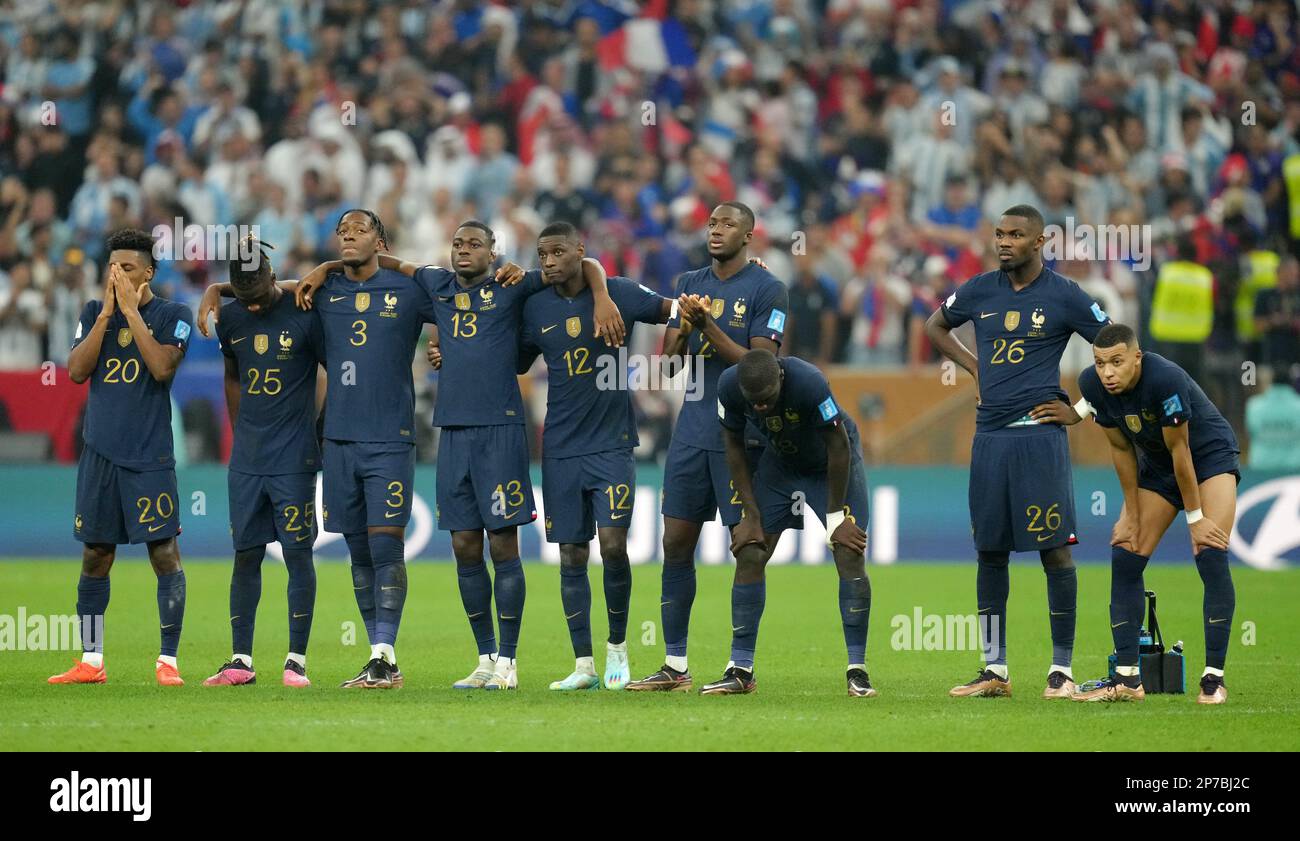 France's Kylian Mbappe (right) and teammates show their dejection after ...