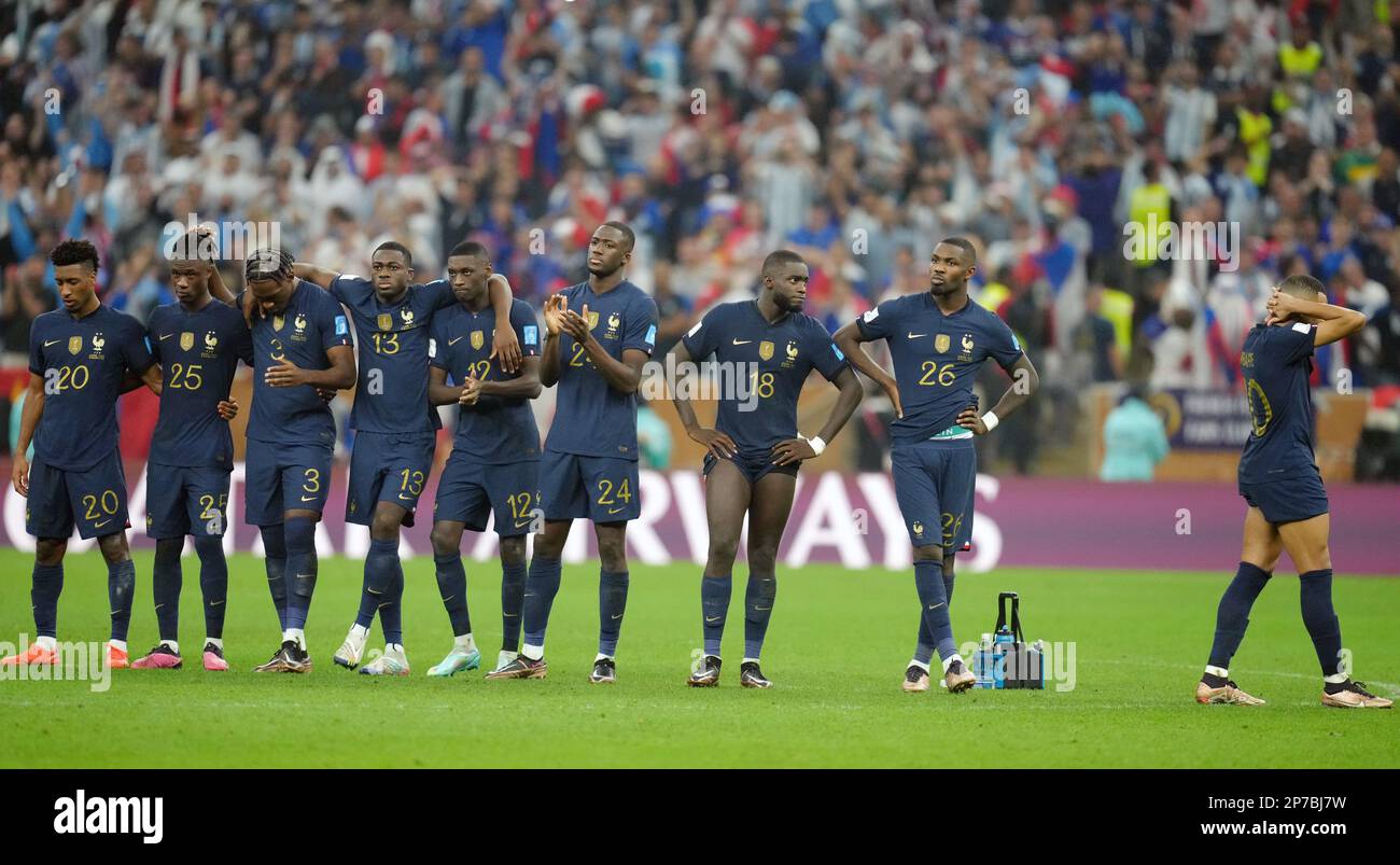 France's Kylian Mbappe (right) and teammates show their dejection after ...