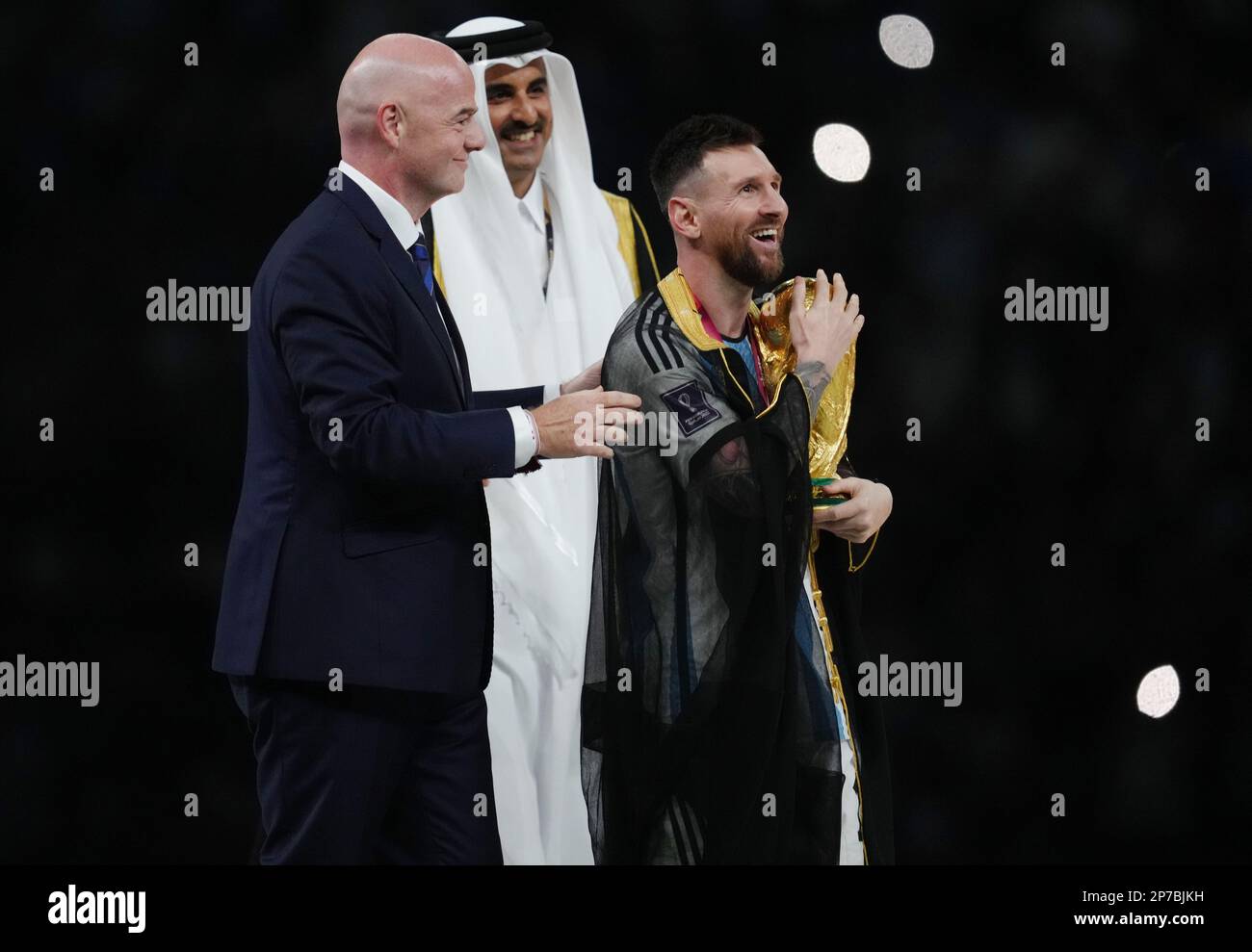Argentina's Lionel Messi hugs the World Cup Trophy as Emir of Qatar ...