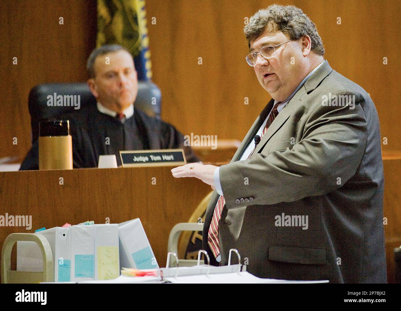 John Storkel, attorney for Bruce Turnidge, reviews binders of testimony ...