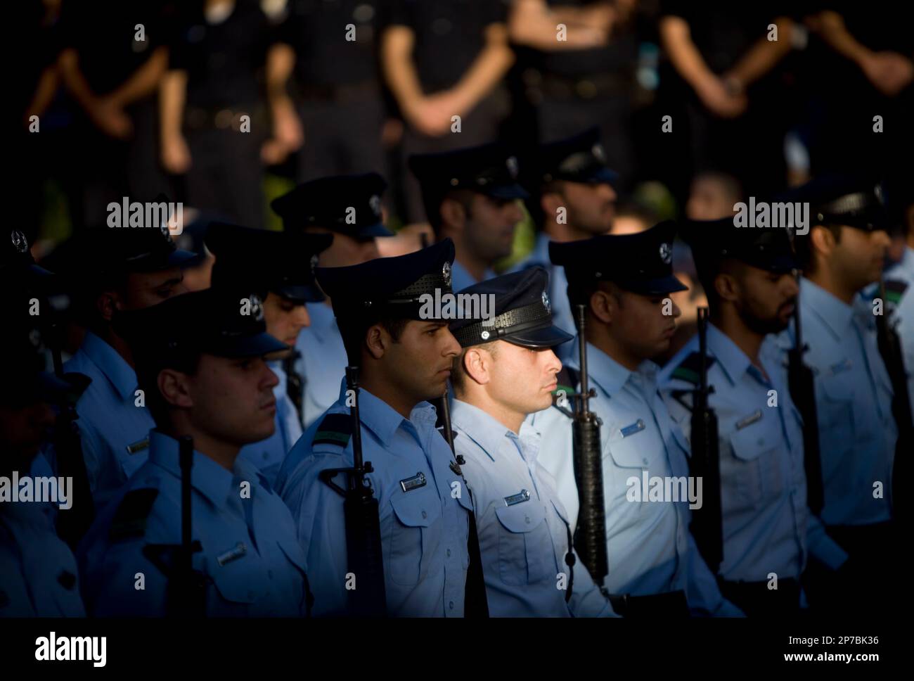 Israeli police honor guard stand at attention during the funeral of ...