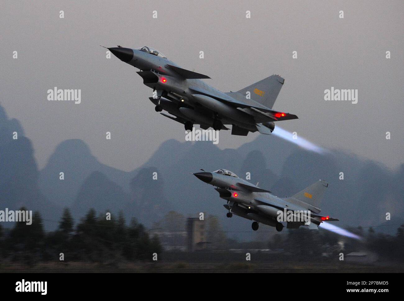 Two J-10 fighter jets of the Chinese PLA Air Force take off for a day ...