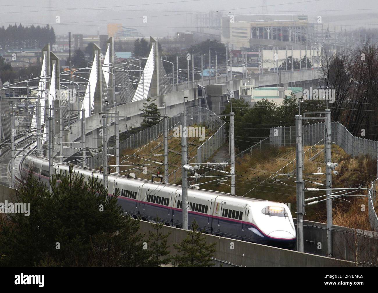 The Tokyo-bound Tohoku Shinkansen train runs from Shin-Aomori Station ...