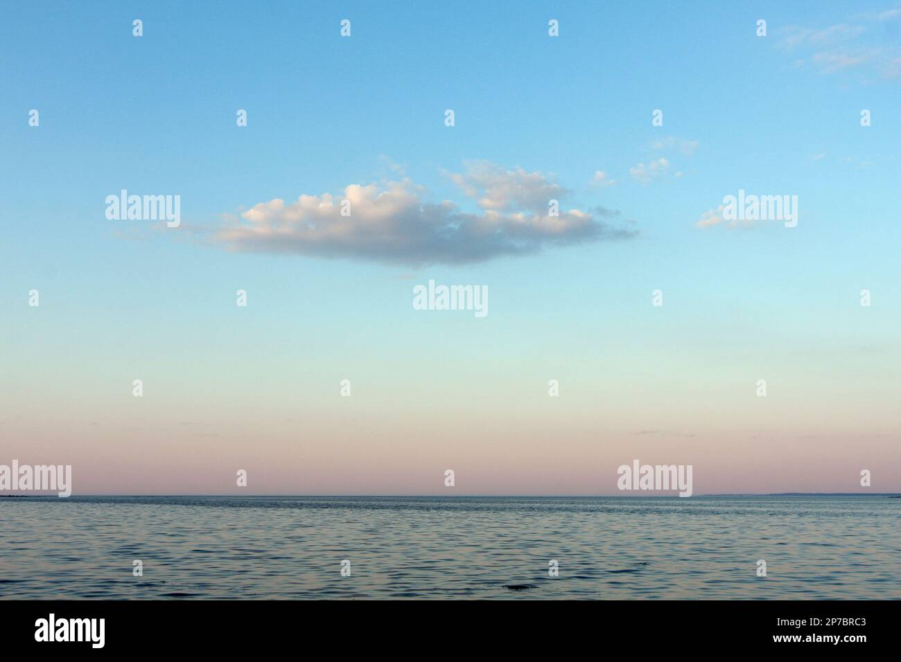 Once there were only one cloud in the sky. Sky in nightfall and ocean ...