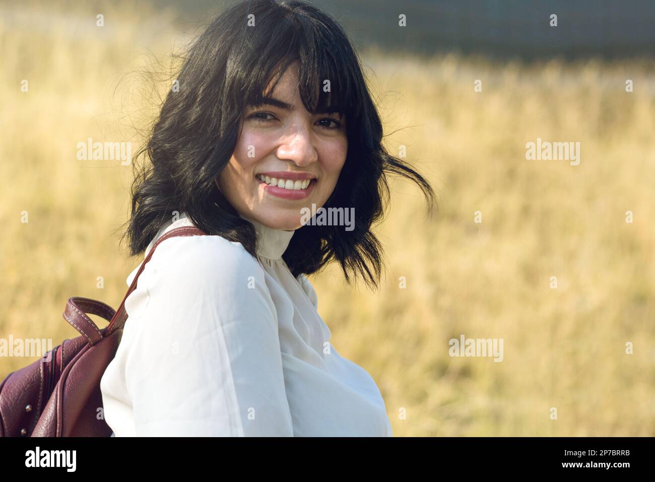 Happy young hispanic woman thinking hi-res stock photography and images - Alamy