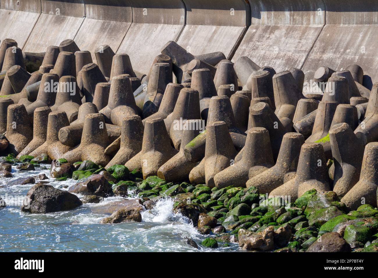 Tetrapod wave-dissipating concrete blocks, Isle of Wight, UK Stock ...