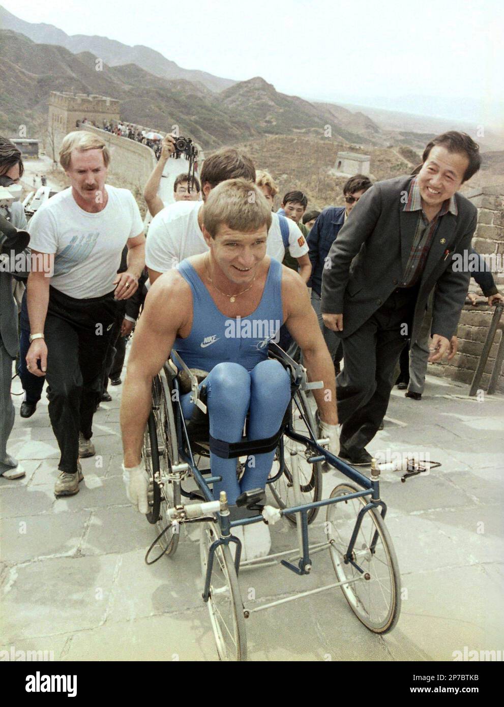 Canadian wheelchair athlete Rick Hansen propels himself up a steep ...