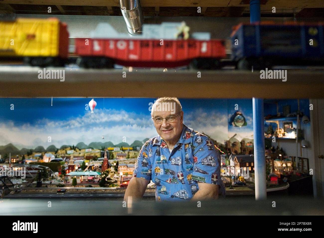 In this undated photo, John Morris poses with some of his train ...