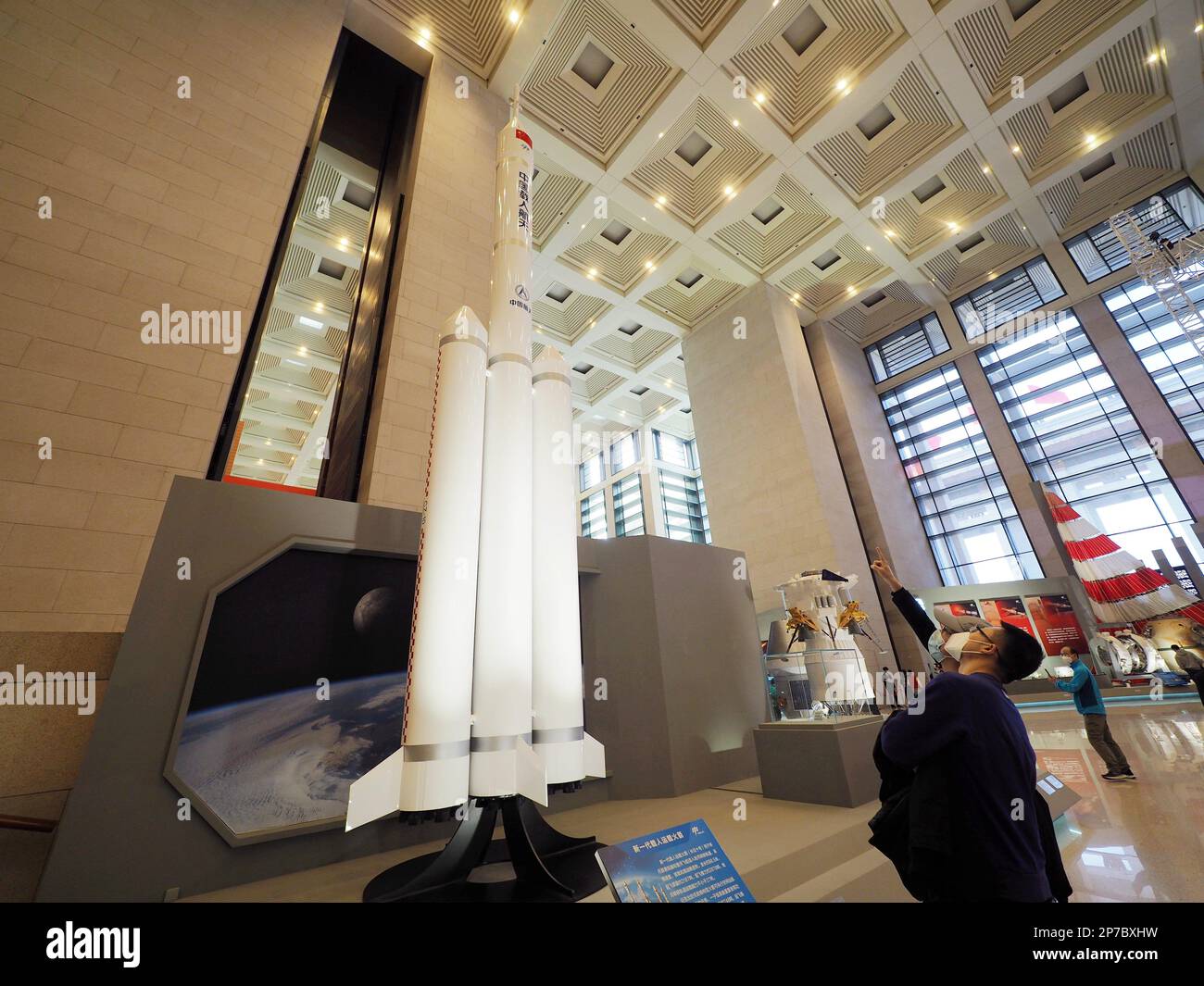 BEIJING, CHINA - MARCH 8, 2023 - Visitors view a model of the "new ...