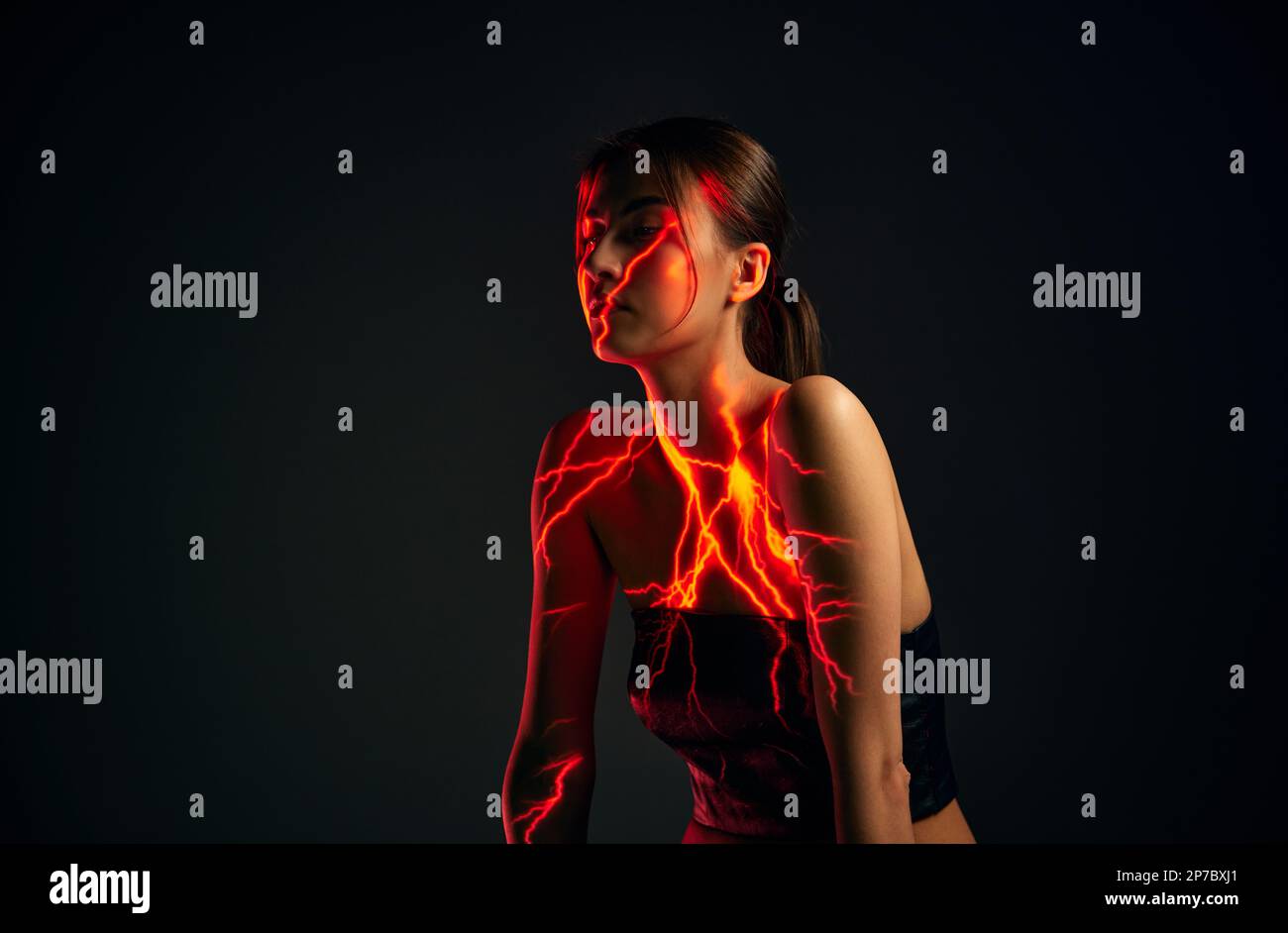 Creative portrait of young sensual woman with digital neon filter ...