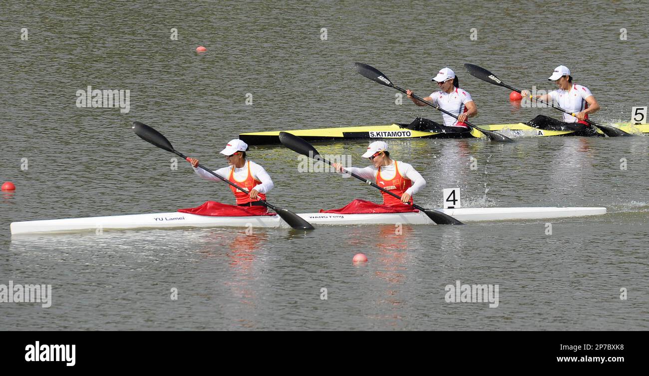 Gold medal winners Yu Lamei right, and Wang Feng of China race ahead of ...
