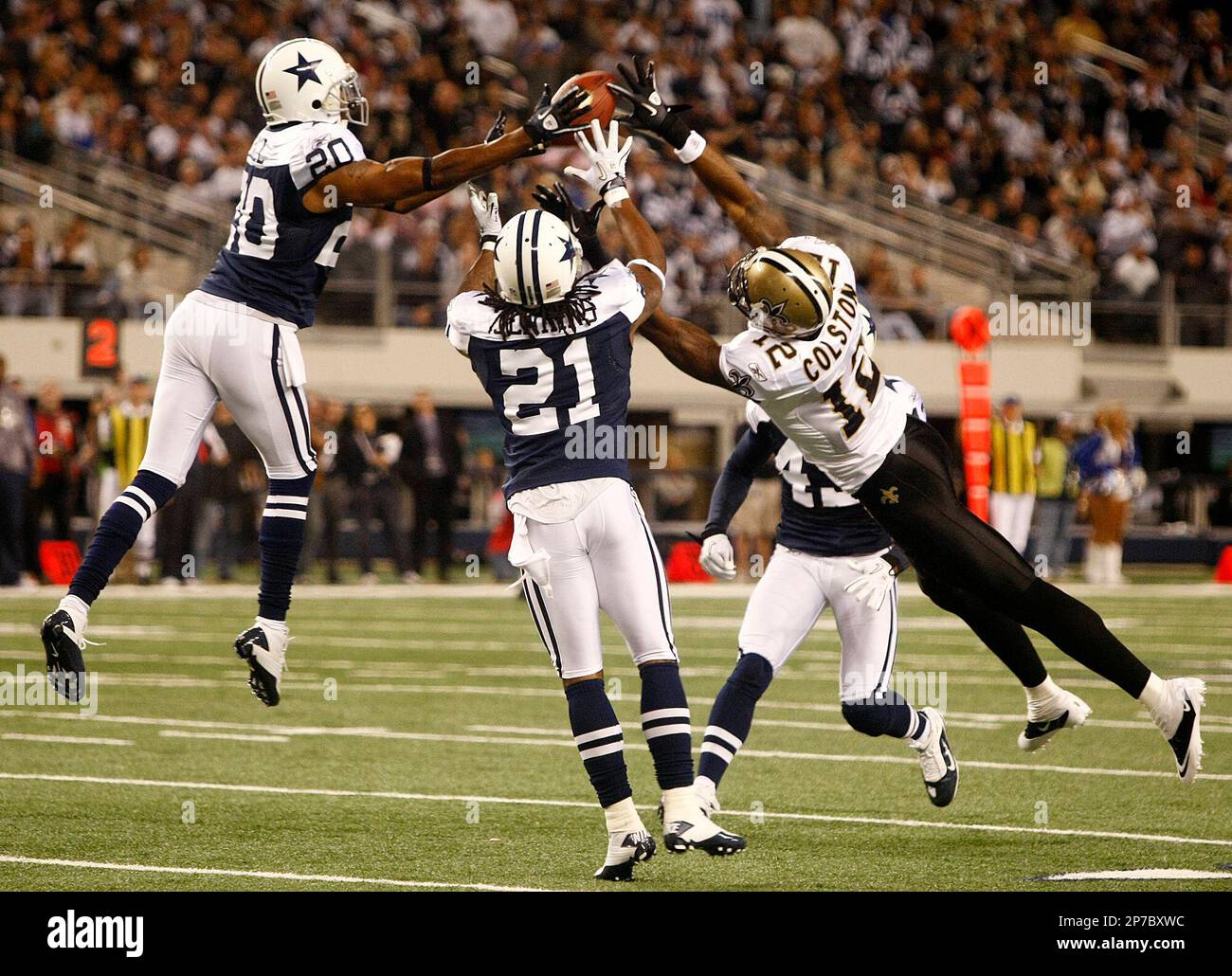 Dallas Cowboys cornerback Alan Ball (20) and Mike Jenkins (21) deflect ...