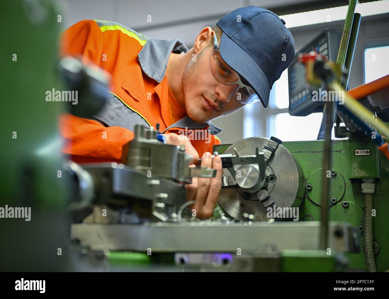 08 March 2023, Brandenburg, Eisenhüttenstadt: Jonas Kraske, apprentice ...