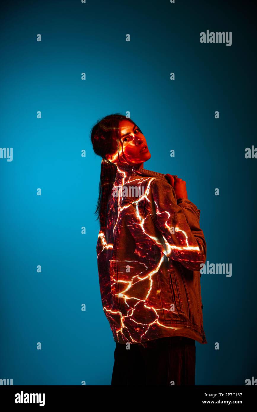 Futuristic style portrait of young woman with digital neon filter ...