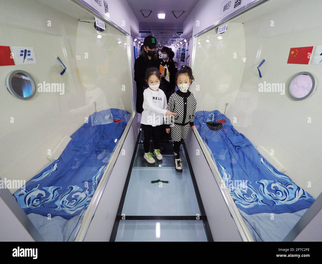 BEIJING, CHINA - MARCH 8, 2023 - Visitors look inside the model of ...