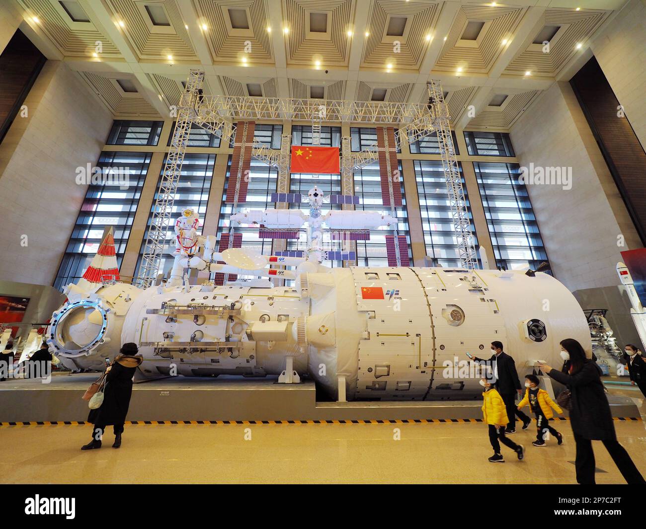 BEIJING, CHINA - MARCH 8, 2023 - Visitors view a model of the "Tiangong ...