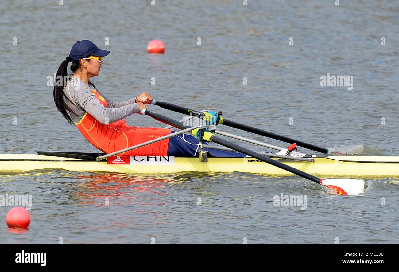 Tang Bin of China competes in the women's single sculls final during ...