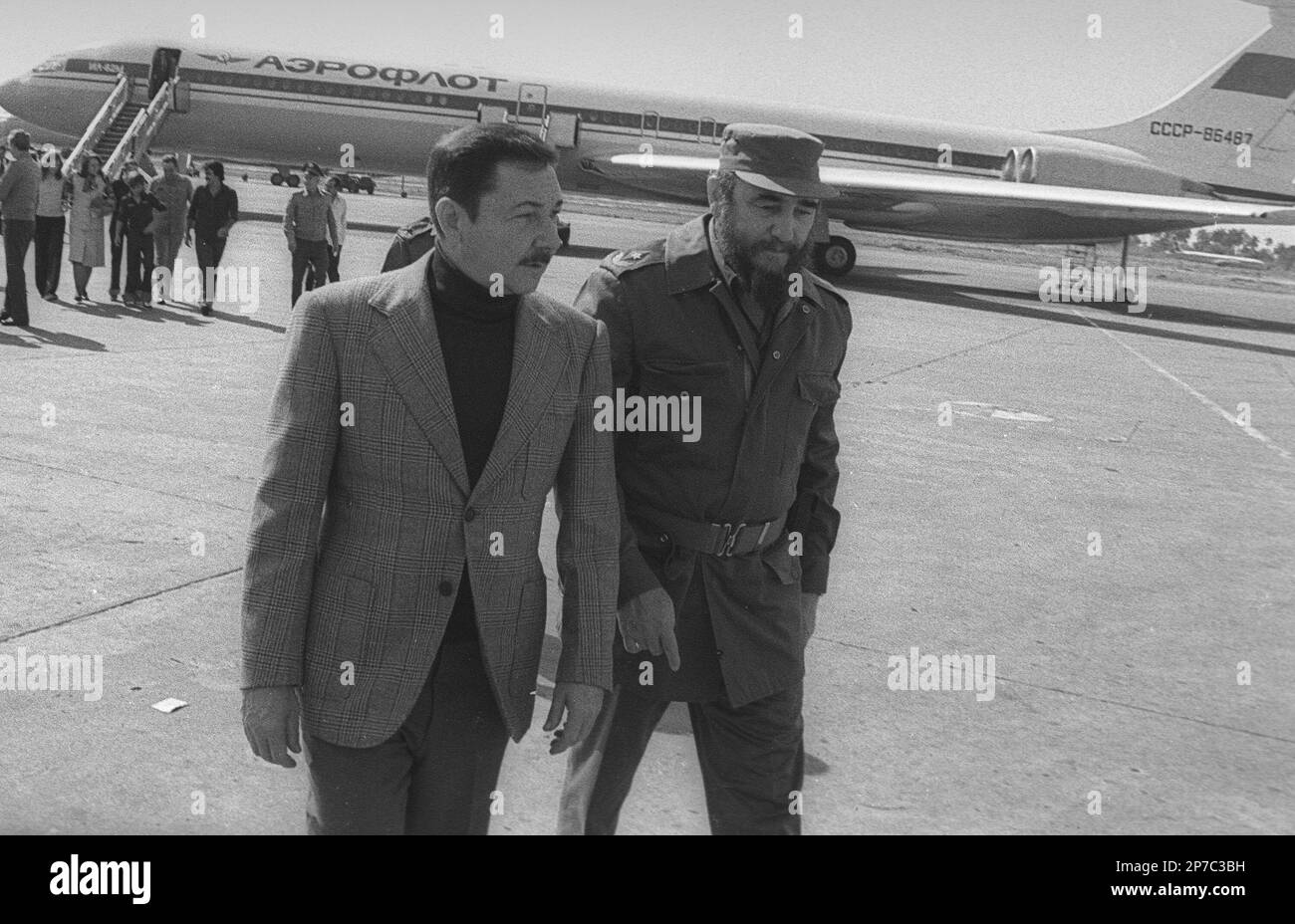 Cuba's leader Fidel Castro, right, walks with his brother Raul Castro ...
