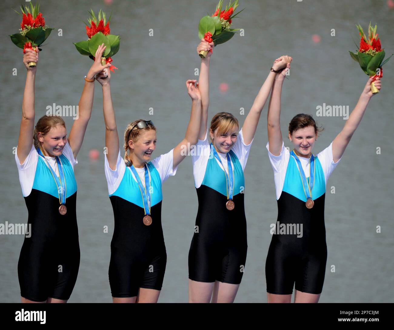 The Kazakhstan women's rowing Four celebrate on the podium after ...